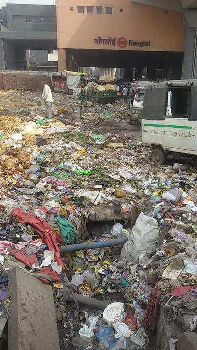 Stinking mess outside Metro station - Times of India