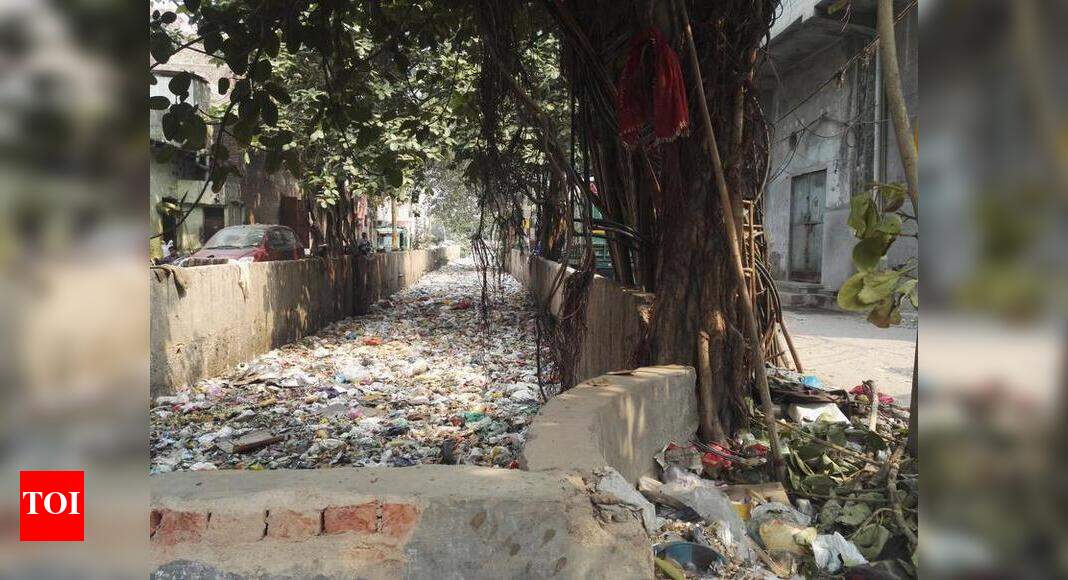 Open drain is a giant trash pit - Times of India