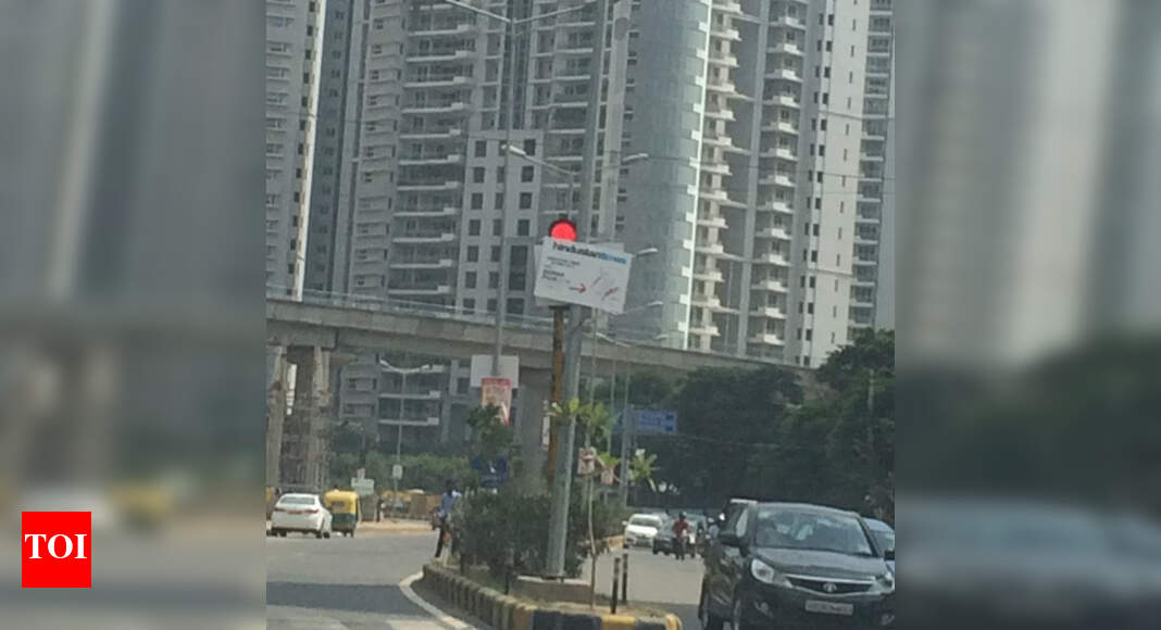 Covered traffic light in ggn - Times of India