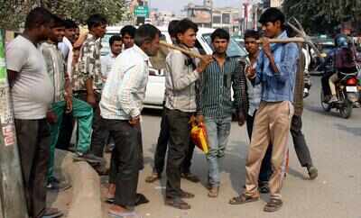 At Labour Chowk, a futile wait for work | Gurgaon News - Times of India