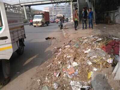 Pothole, debris, garbage - Times of India