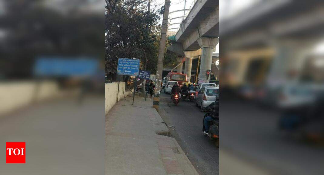 EDMC signboards in middle of footpath - Times of India