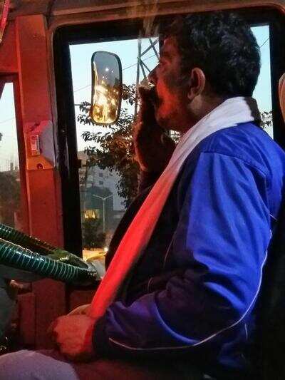 Bus driver smokes while driving - Times of India