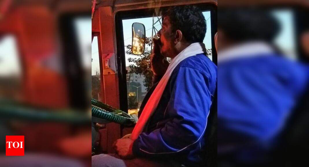 Bus driver smokes while driving - Times of India