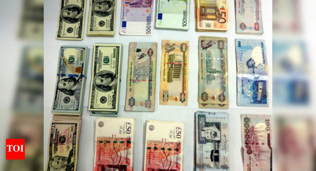 Flyer held with Rs 10 lakh in foreign currency | Delhi News - Times of ...