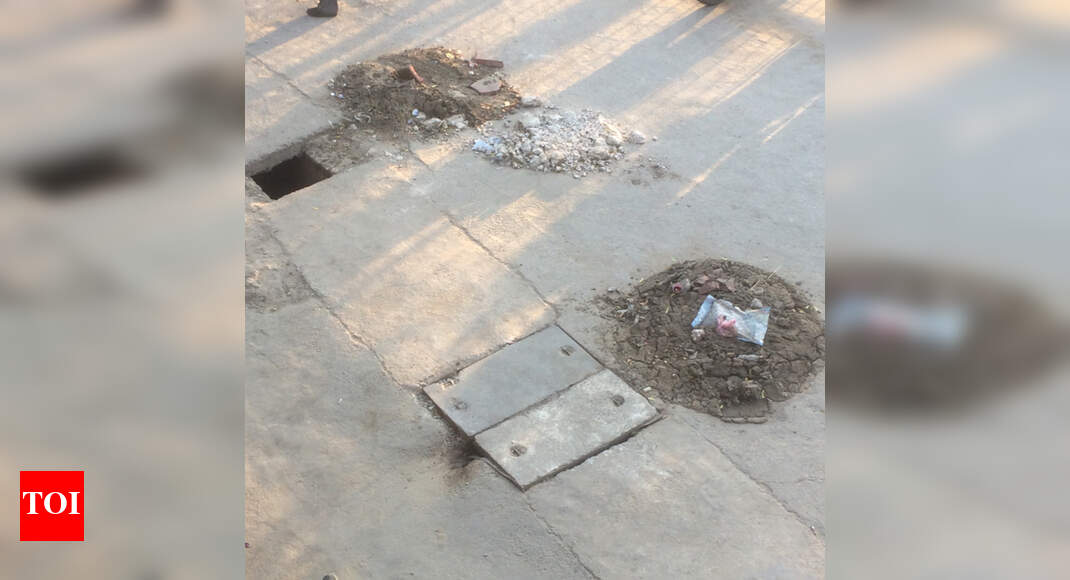 Waste from manhole not cleared - Times of India