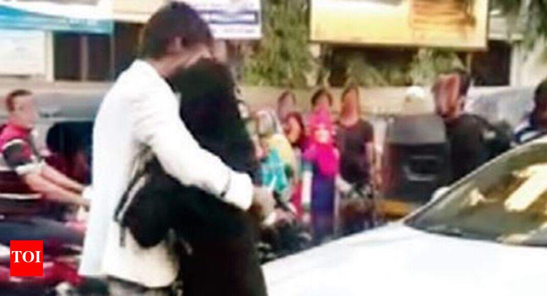 Couple forced to apologise as video of hug goes viral | Mumbai News - Times of India