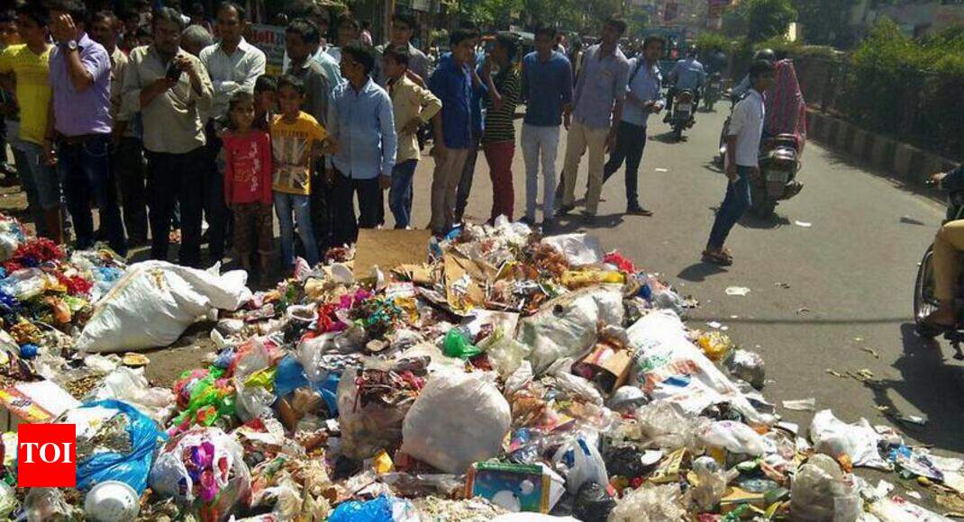 Residents dump garbage on road to protest poor services | Surat News ...