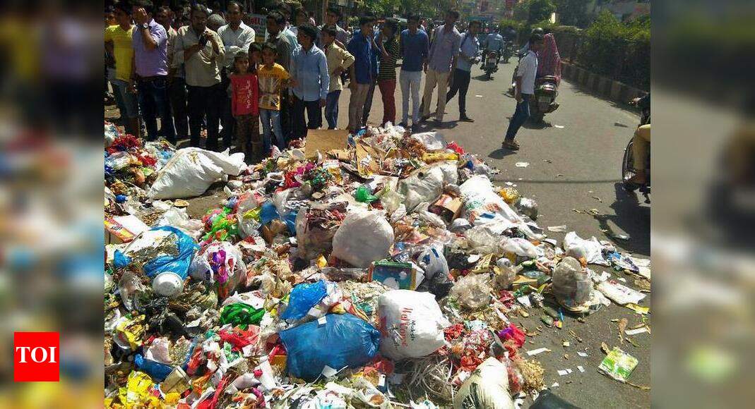 Residents dump garbage on road to protest poor services | Surat News ...