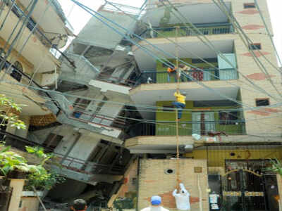 W Delhi building falls on another, 5 hurt | Delhi News - Times of India