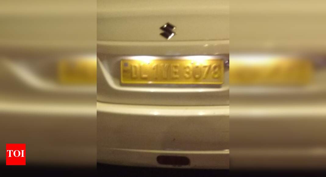 Taxi with Tampered Number Plate - Times of India