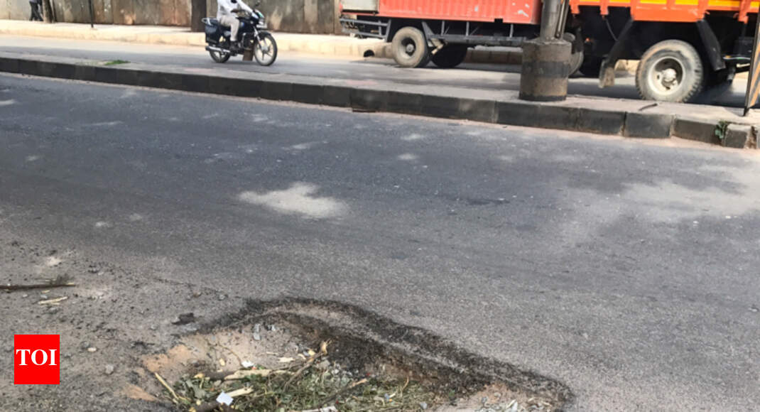 deadly pothole - Times of India