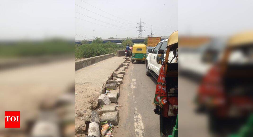 Footpath in bad shape - Times of India