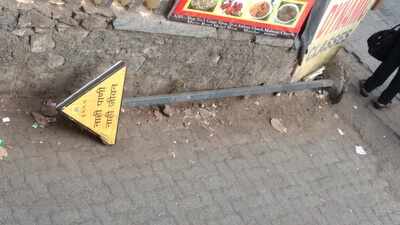 FALLEN SIGNBOARD - Times of India