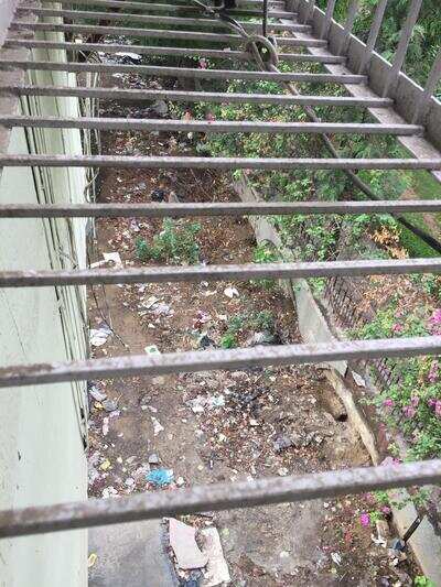 Back lane disappears under garbage - Times of India
