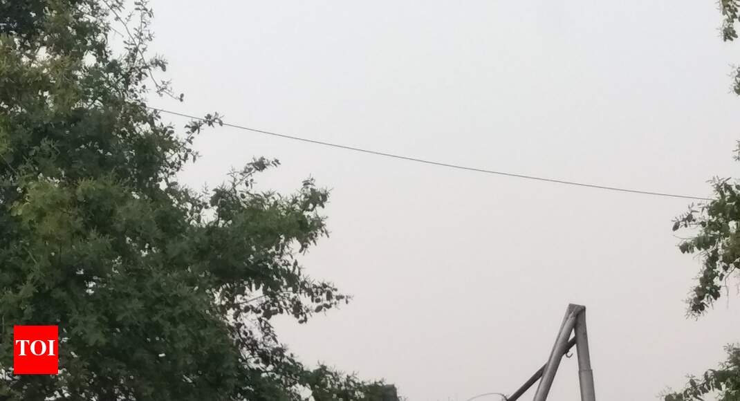 Damaged lamp post - Times of India