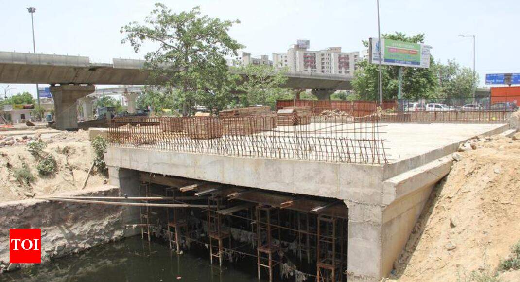 Work on 3-lane bridge stops as water released into canal | Noida News ...