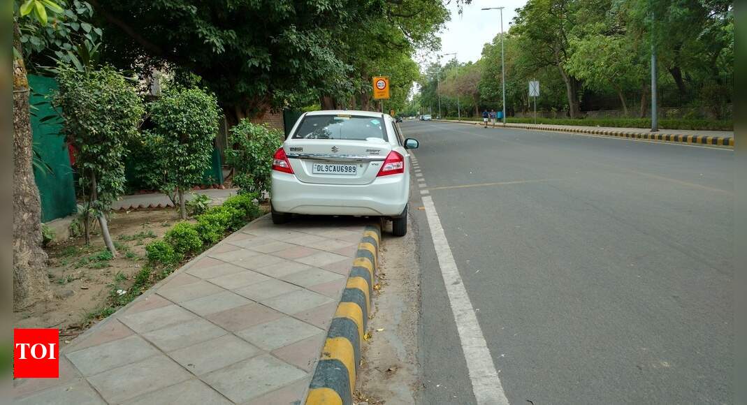 Footpath for cars, not for pedestrians - Times of India