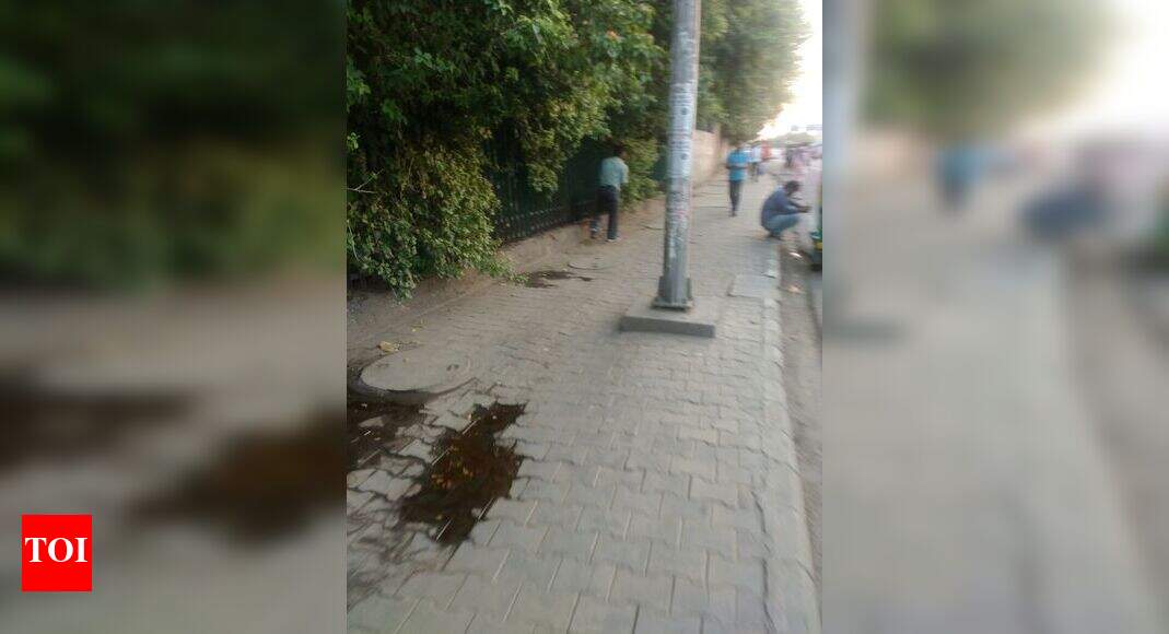 Footpath is a public loo - Times of India
