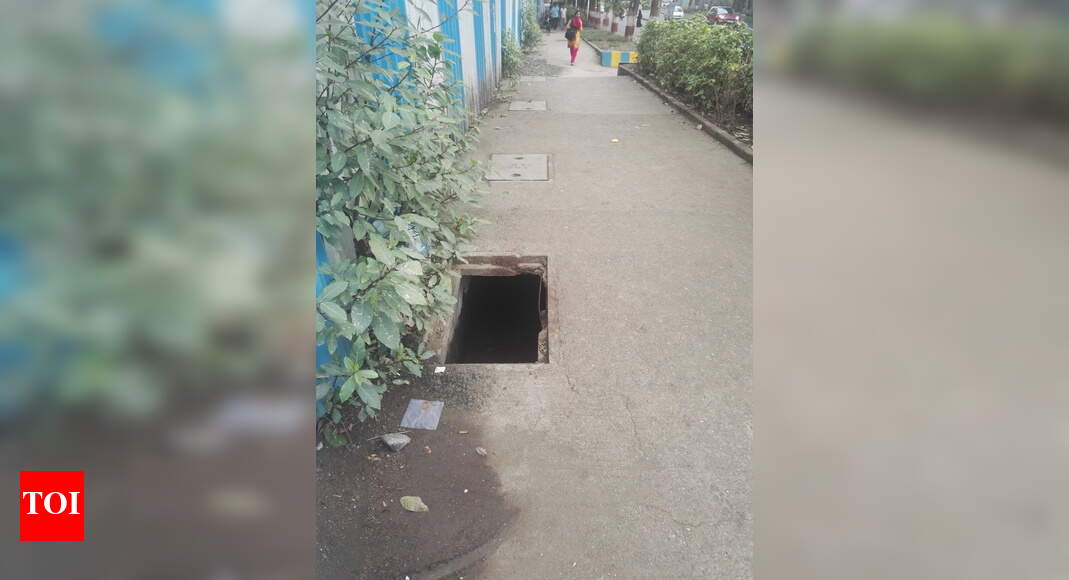 Open pothole on footpath - Times of India