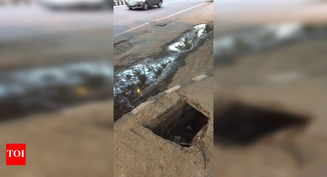 Open drain on footpath - Times of India
