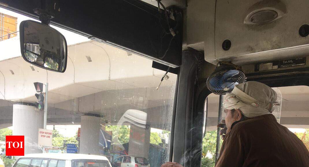 DTC Bus Driver smoking while driving - Times of India