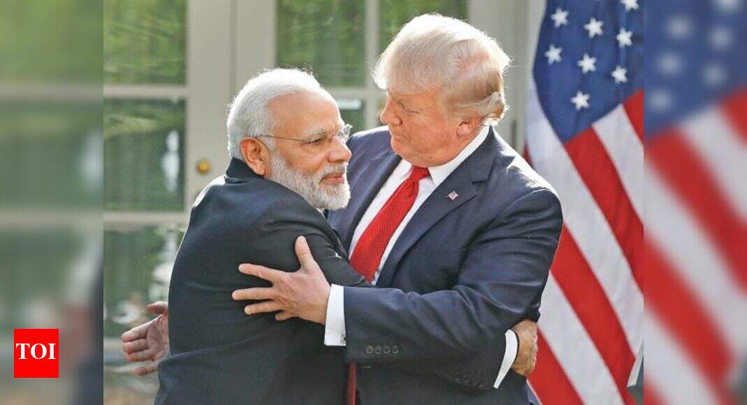 Modi's bear hug trumps the awkward handshake! - Times of India