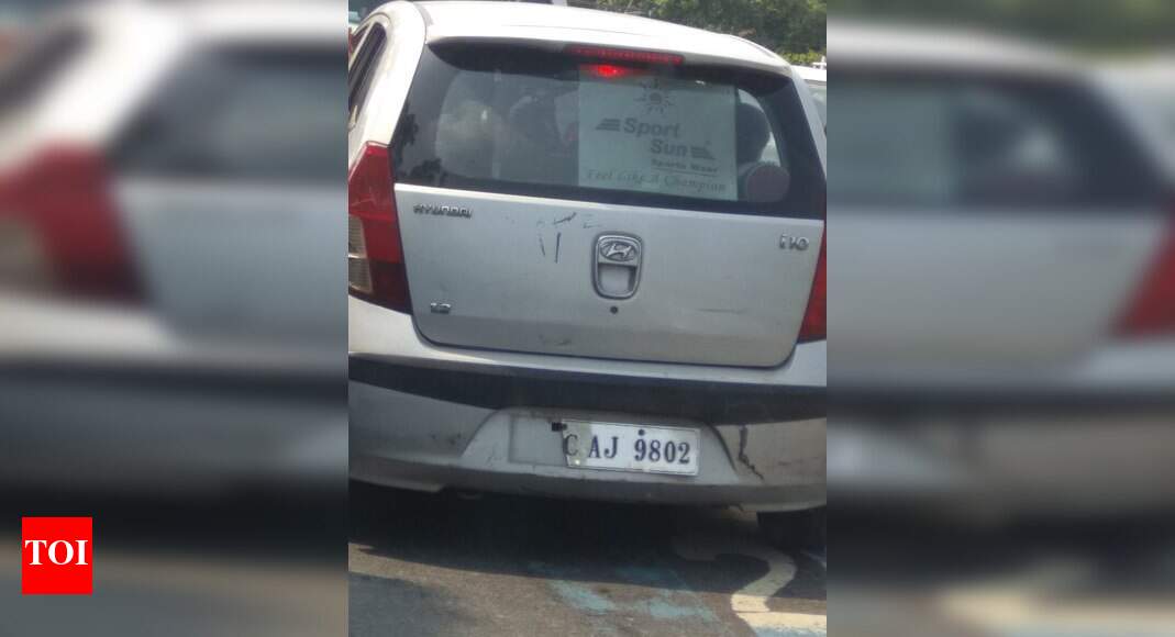 car with broken number plate - Times of India