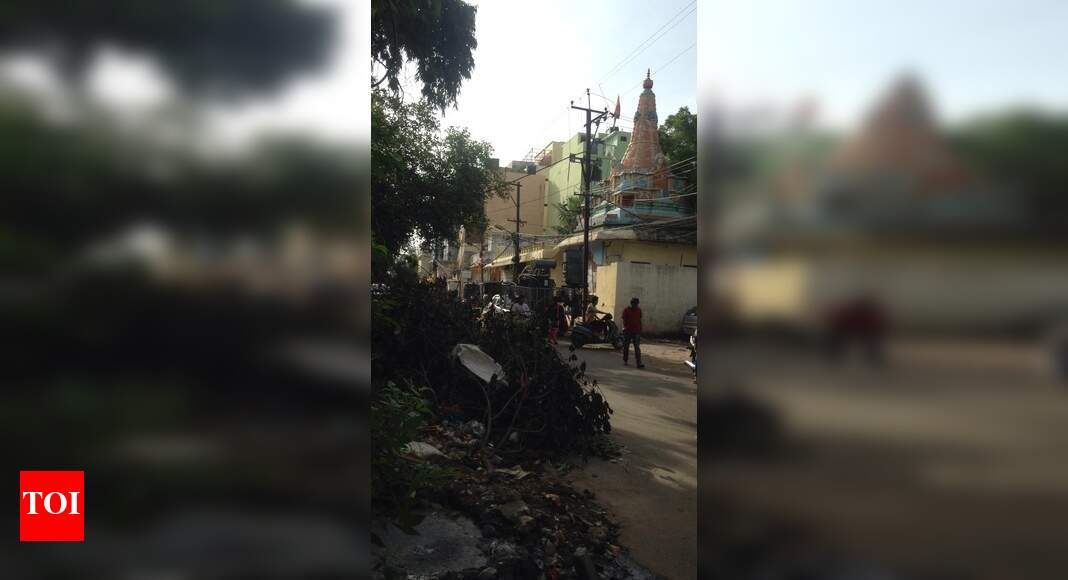 Garbage overflow near Temple - Times of India