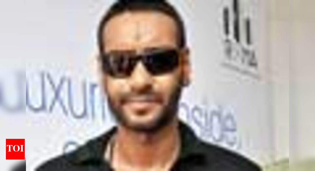 Ajay’s cigarette punching machine! | Hindi Movie News - Times of India