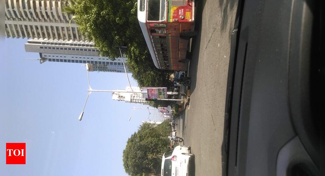 Obstruction of traffic signals by posters - Times of India