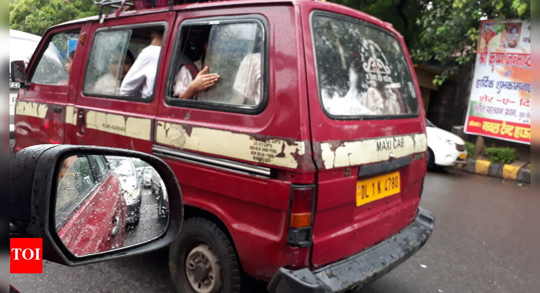 There is at least 20 kids in this private school van - Times of India