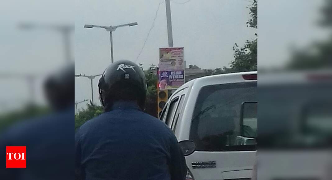 Traffic light blocked by hoarding - Times of India