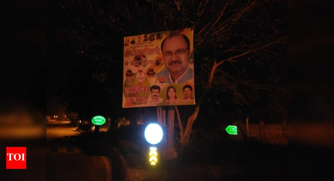 Hoarding on tree - Times of India