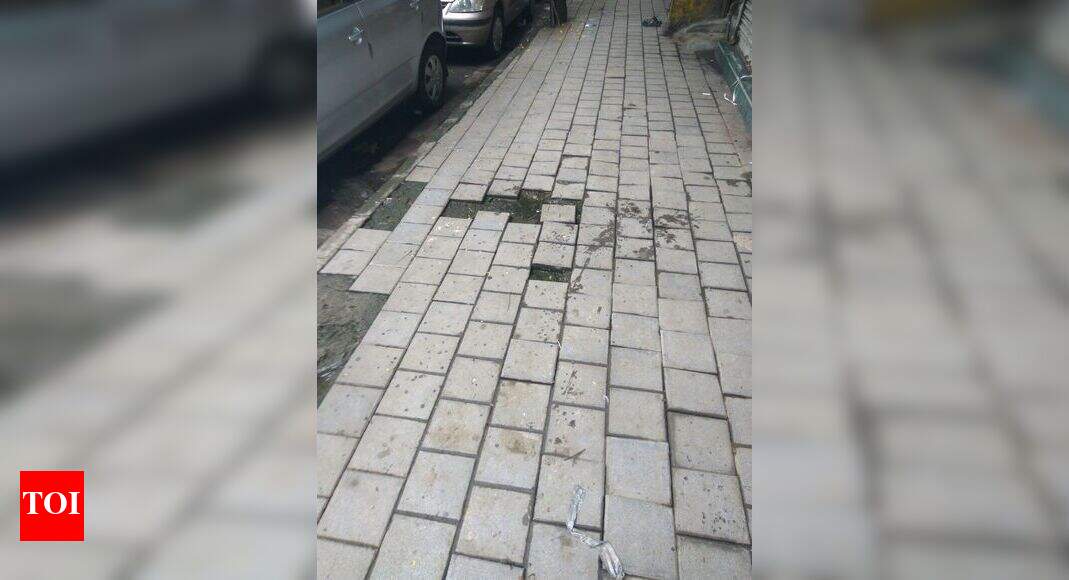 Footpath in bad shape - Times of India