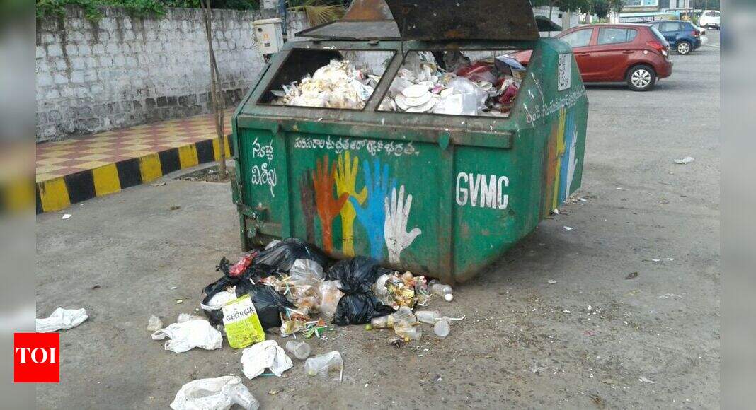 Over loaded dust bin - Times of India