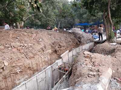 Open pit, protruding iron rods - Times of India