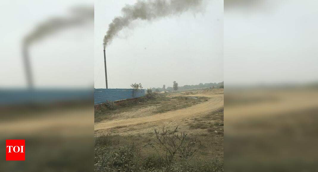 Factory spewing smoke - Times of India
