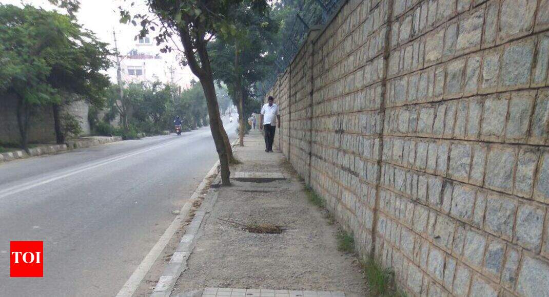 gutter slabs open on footpath - Times of India