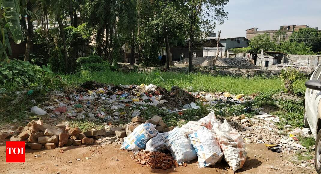 Pond turned into Garbage VAT - Times of India