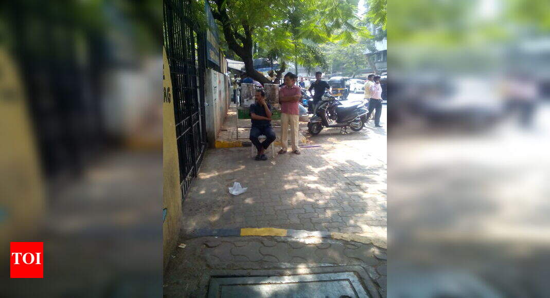 garbage bin blocking footpath - Times of India