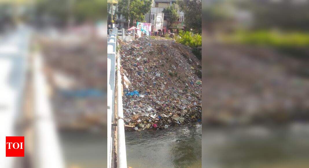 Canal bund filled with garbage - Times of India