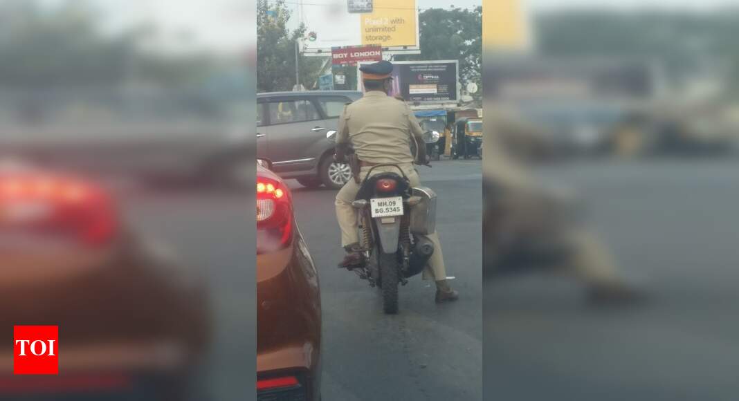 policeman without helmet and ahead of zebra - Times of India