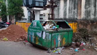 Over flowing dust bin - Times of India