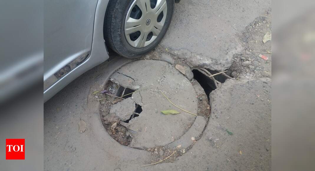 Manhole cover broken - Times of India