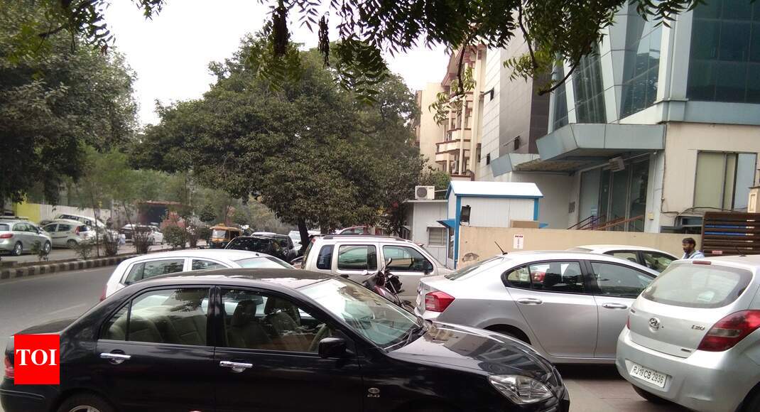 Encroachment on footpath and road - Times of India