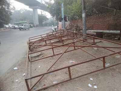 Hoarding frame on walkway - Times of India