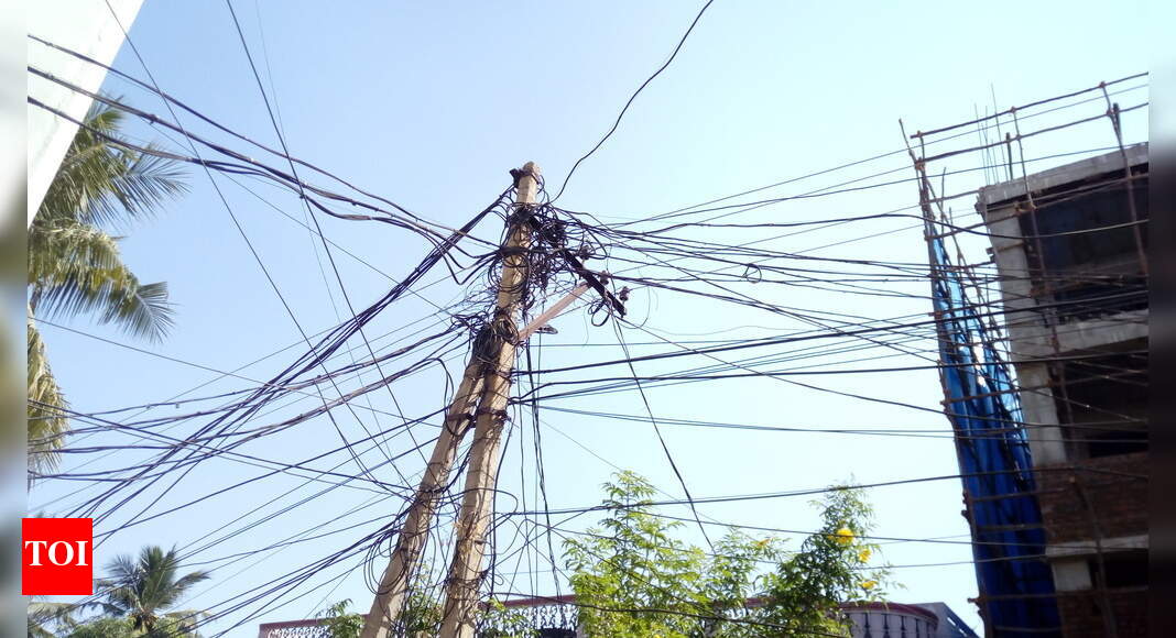 Over loaded service wires on one electric pole. - Times of India