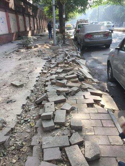 Broken sidewalks since a month - Times of India