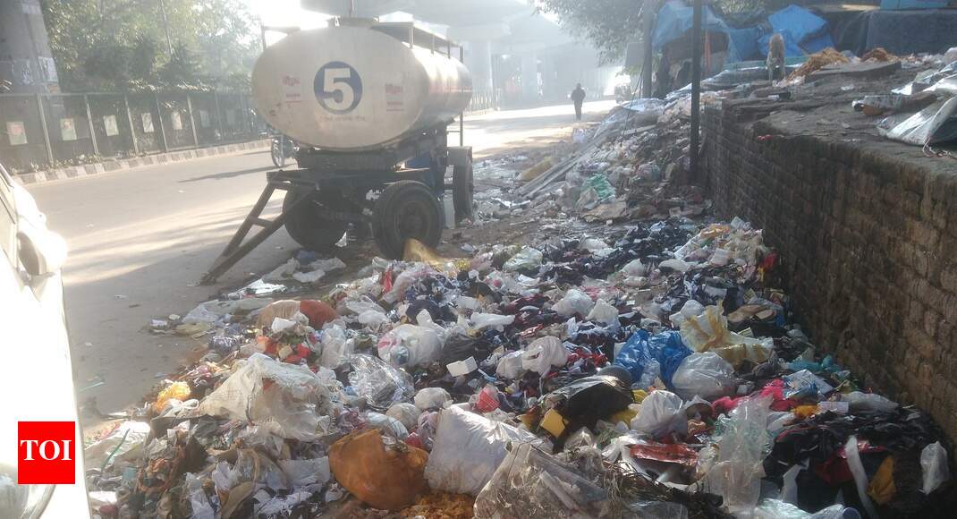 Garbage dump on road - Times of India